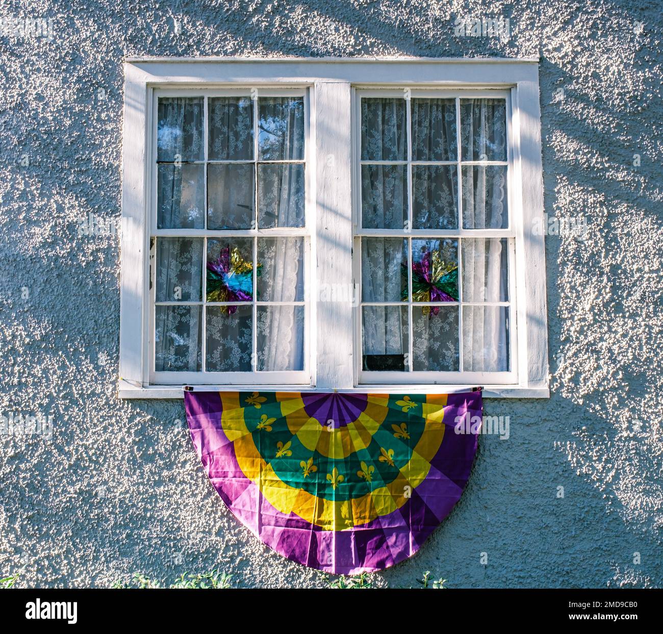 NEW ORLEANS, LA, USA - JANUARY 13, 2023: Window of residence displaying ...