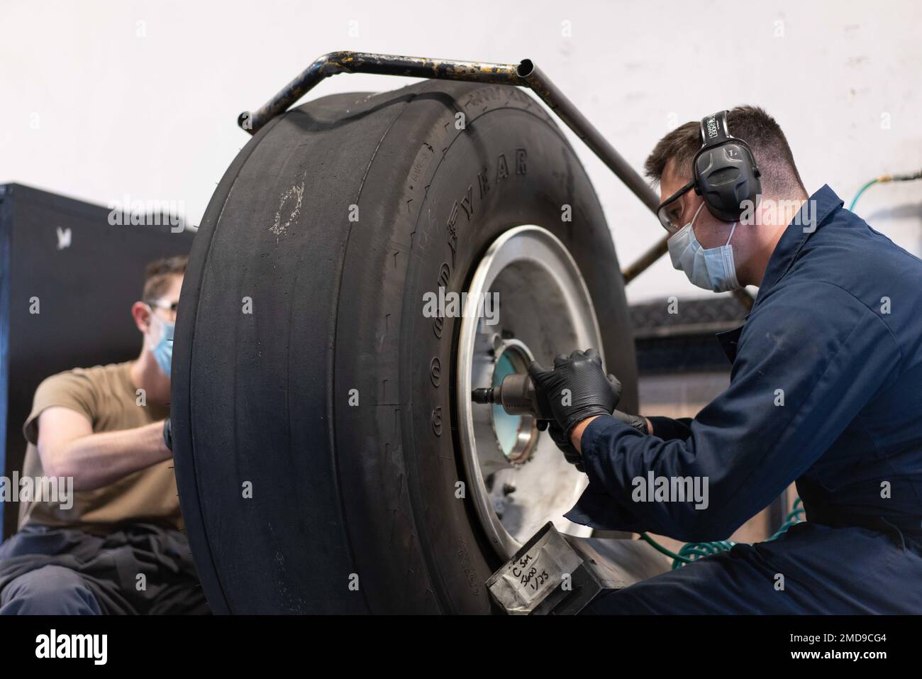 U.S. Air Force Senior Airman Christopher Tyrrell, right, 60th ...
