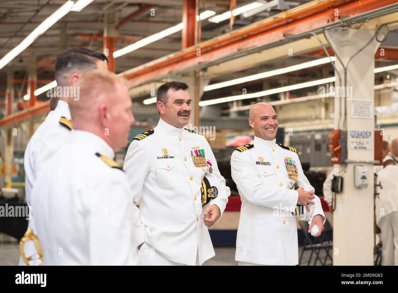 Cmdr. Robert Patchin, center, outgoing commanding officer, Unmanned Undersea Vehicle Squadron ...