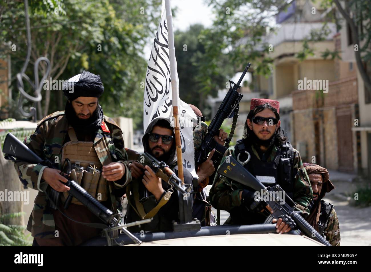 FILE - In this Aug. 19, 2021 file photo, Taliban fighters display their ...