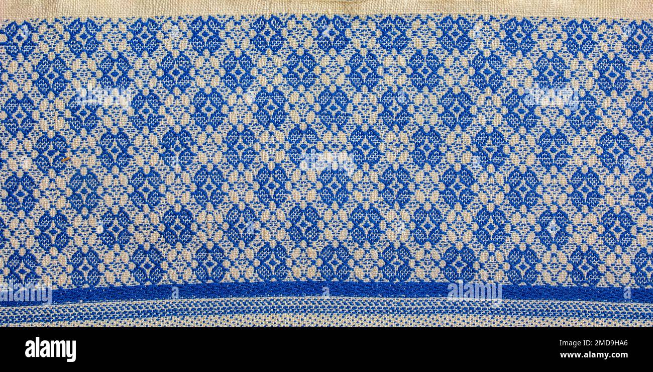 A fragment of the texture of a white-blue tablecloth made in the 1960s ...