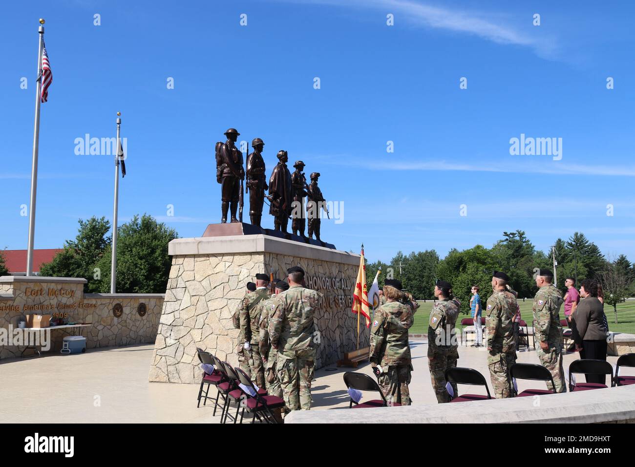 Members of the official party salute as the national anthem is played ...