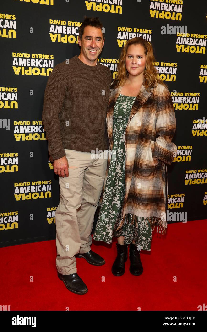 Comedian Amy Schumer, right, with husband Chris Fischer, left, attends ...