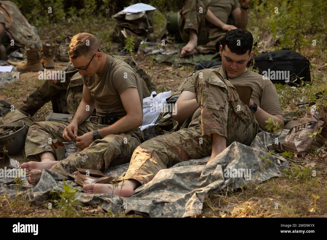 Officer candidates rest and recover between an iteration of night land ...