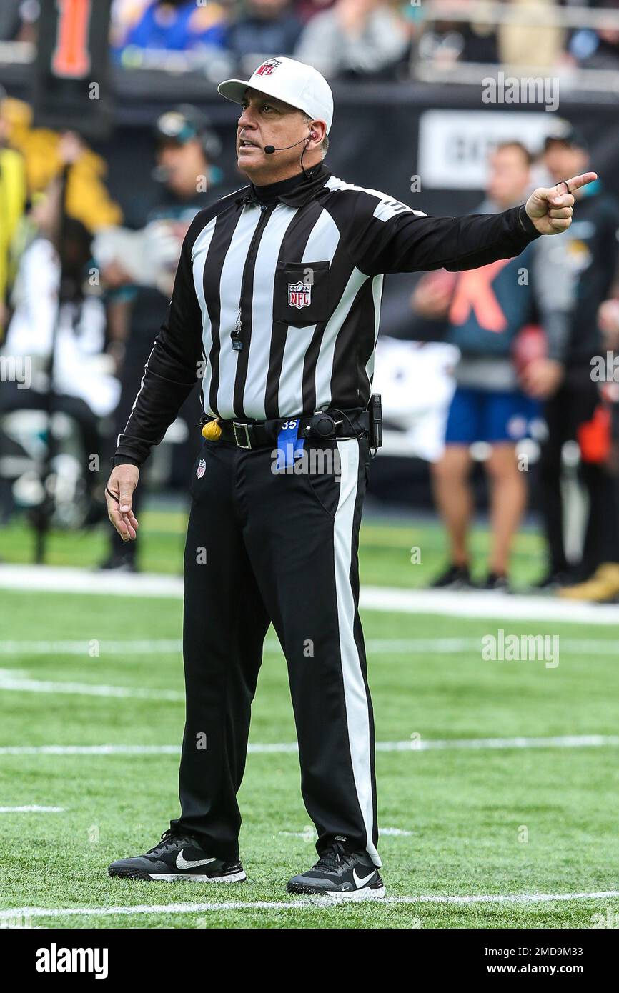 Referee John Hussey (35) makes a call during the first half of an NFL ...