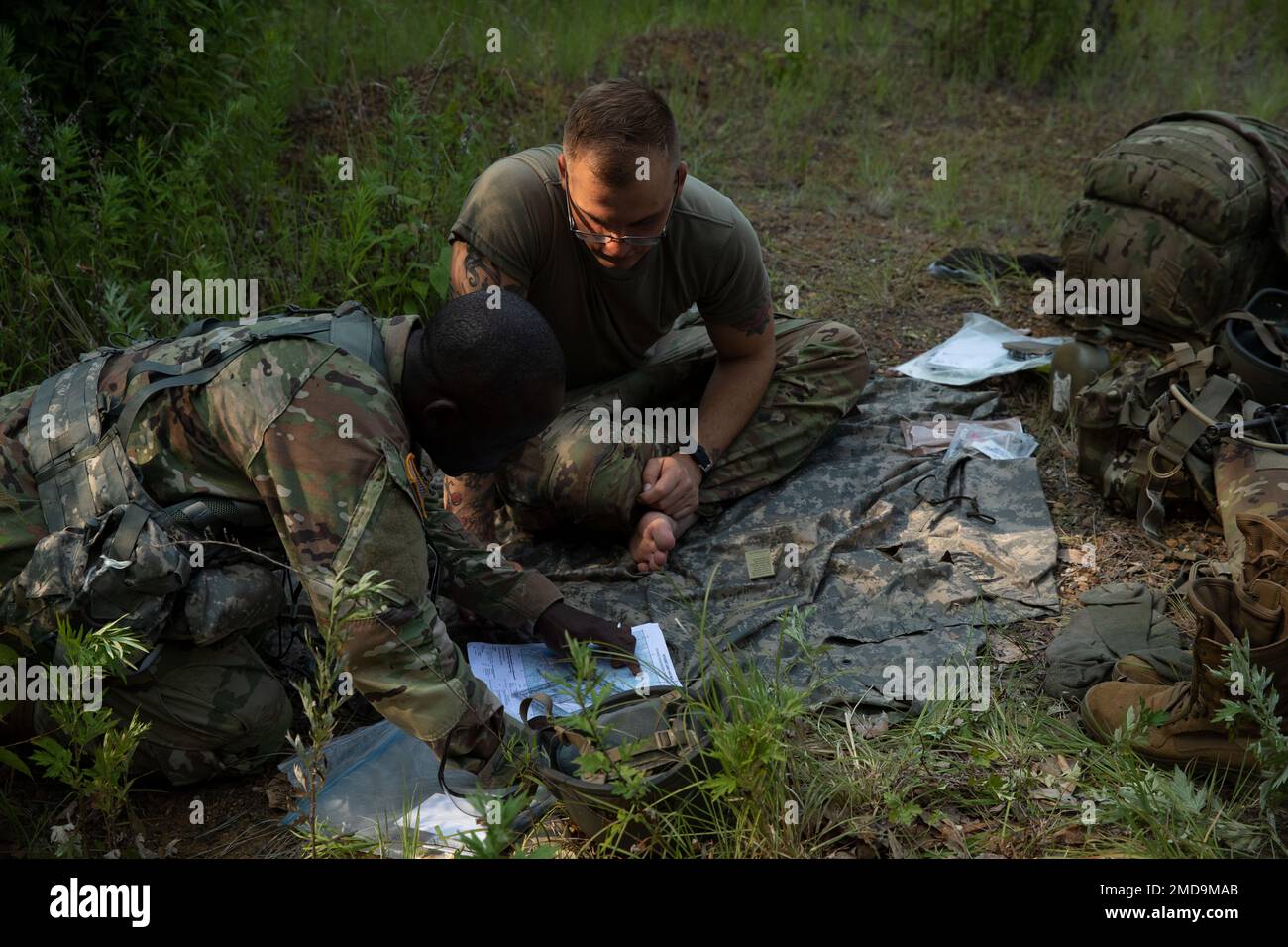 Officer candidates rest and recover between an iteration of night land ...