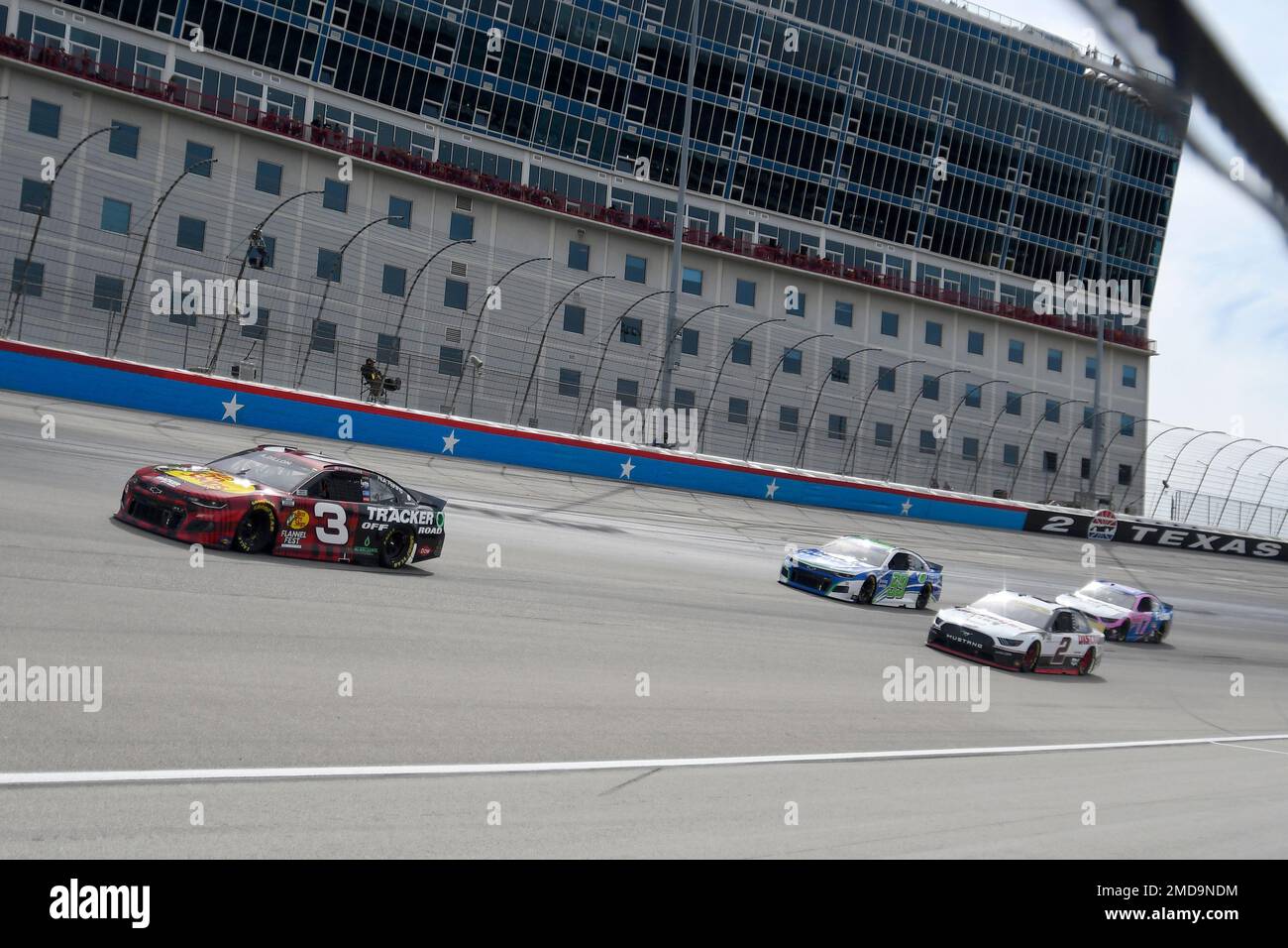 Austin Dillon (3) drives as Daniel Suarez (99), Brad Keselowski (2) and ...