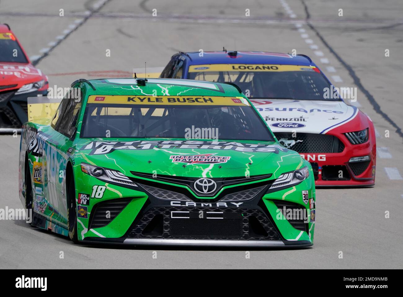 Kyle Busch (18) drives followed by Joey Logano (22) during a NASCAR Cup ...