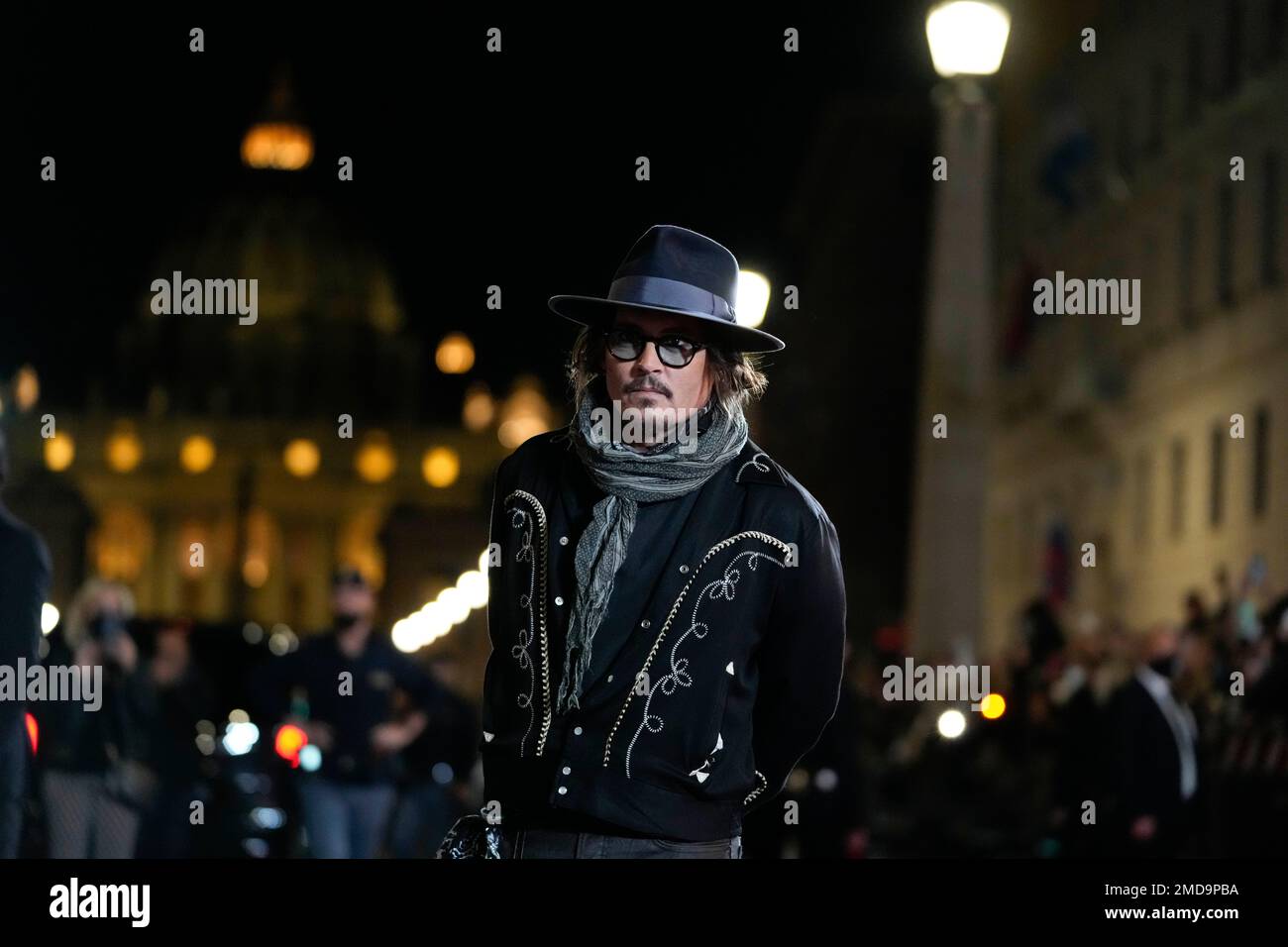 Actor Johnny Depp, backdropped by St. Peter's dome, poses on the red ...