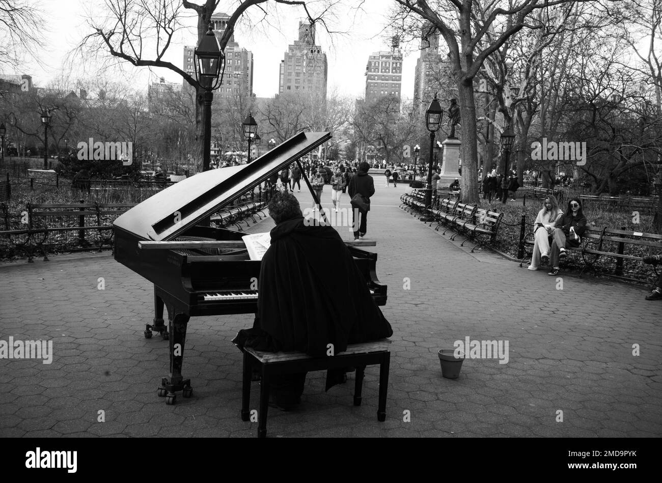 January 22, 2023: COLIN, center plays his piano in Washington Sqaure ...