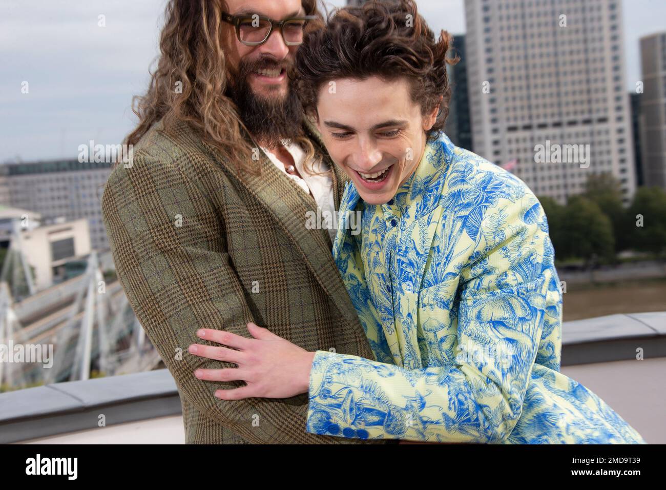 Timothee Chalamet and Jason Momoa hug at the photo call for the film 'Dune' in a central London ...