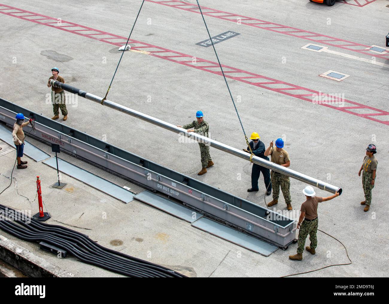 APRA HARBOR, Guam (July 14, 2022) Sailors and civilian service mariners ...