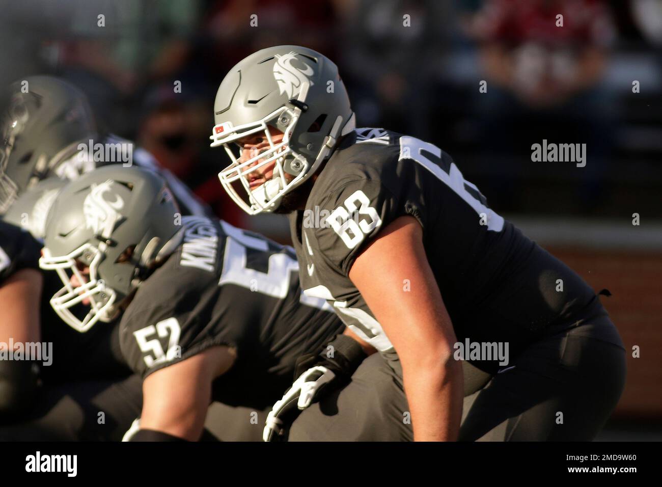 Washington State offensive lineman Liam Ryan (63) lines up for a play ...