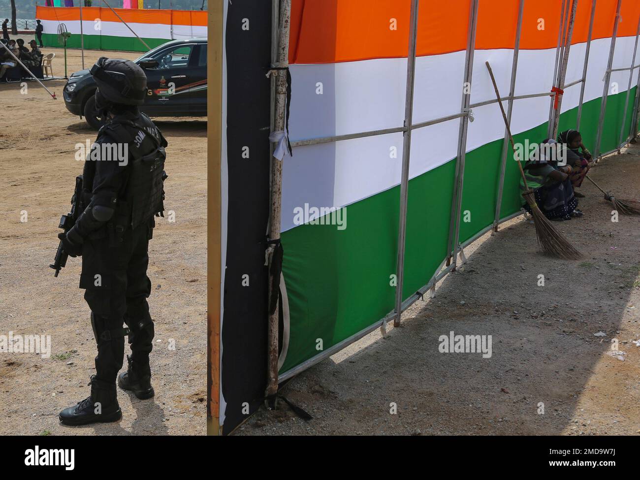 A National Security Guard (NSG) commando stands guard as sweepers take ...