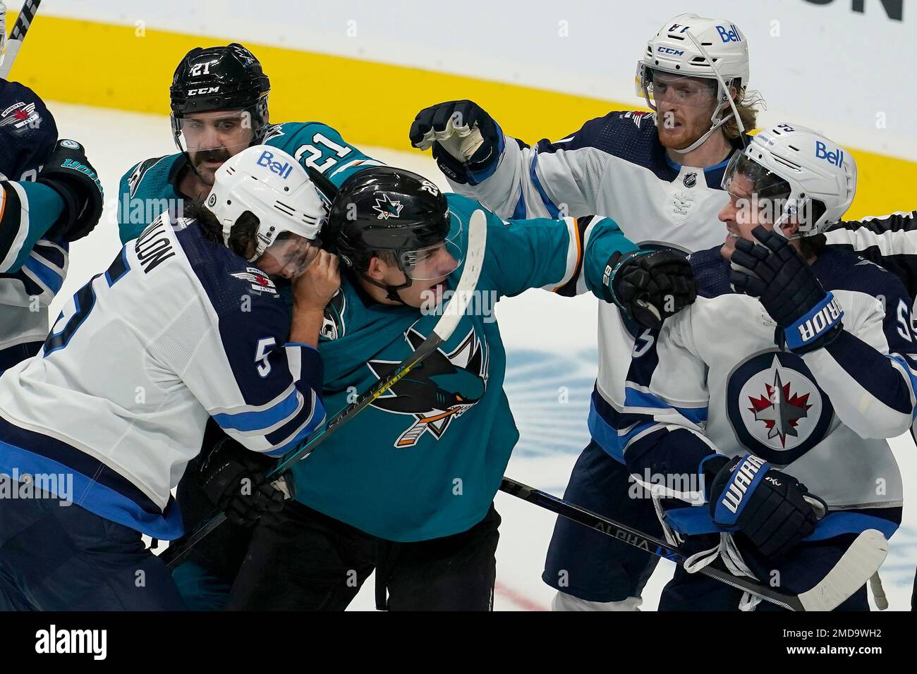 San Jose Sharks' Timo Meier, center, and Jacob Middleton, top left ...