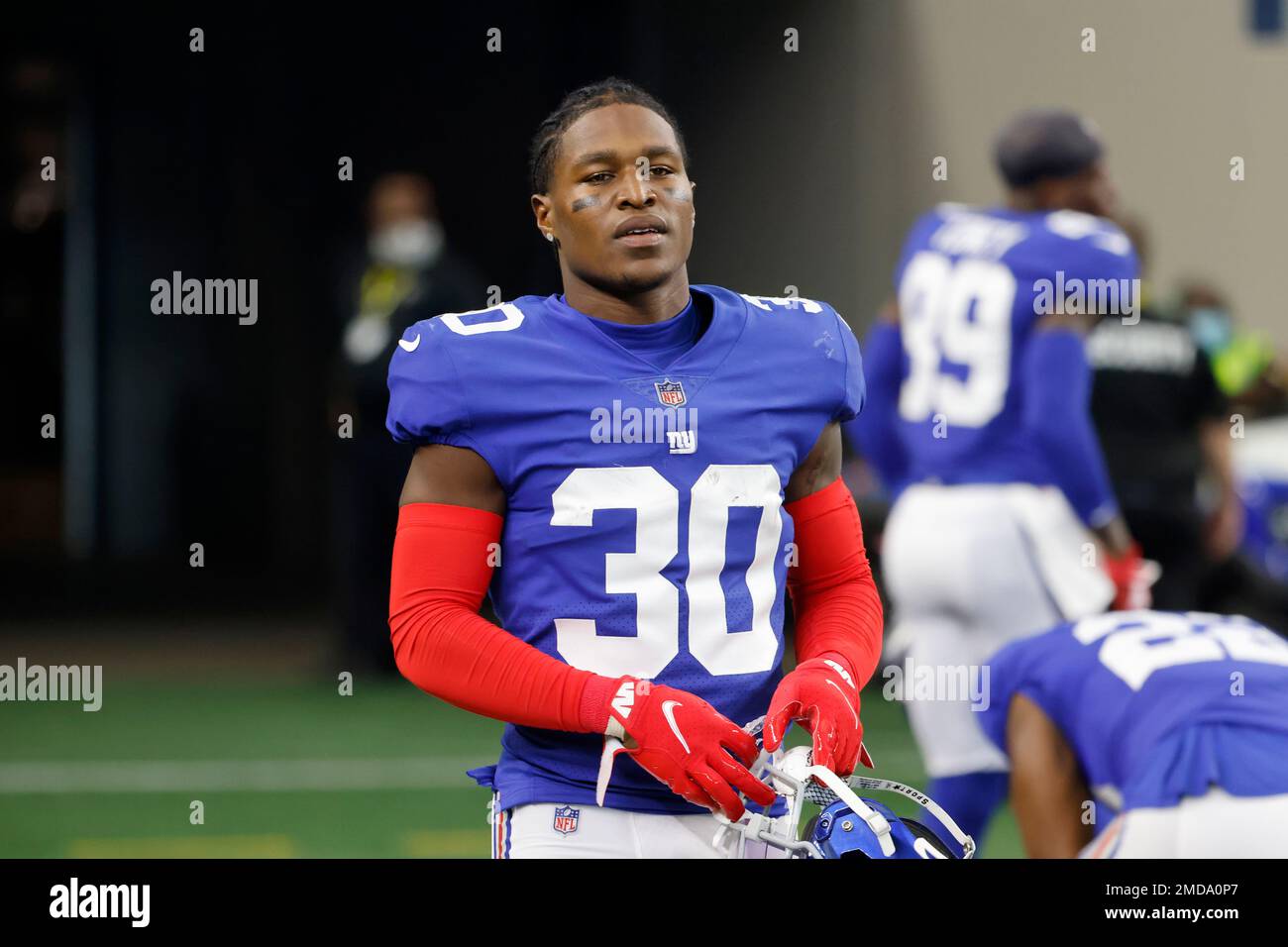 New York Giants cornerback Darnay Holmes (30) walks onto the field ...