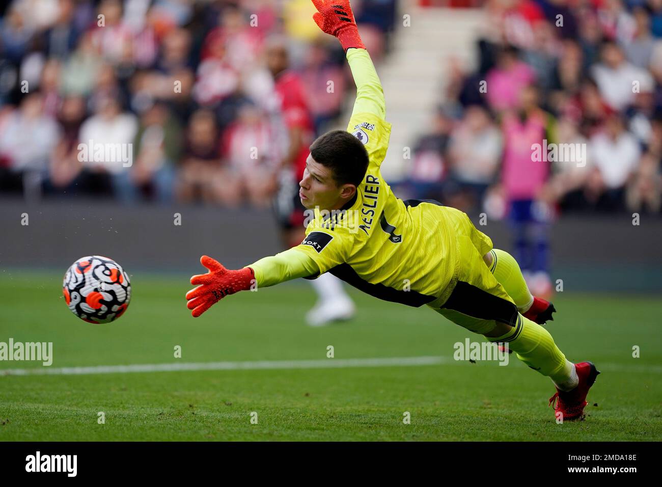 Leeds United's goalkeeper Illan Meslier dives to make a save during an ...