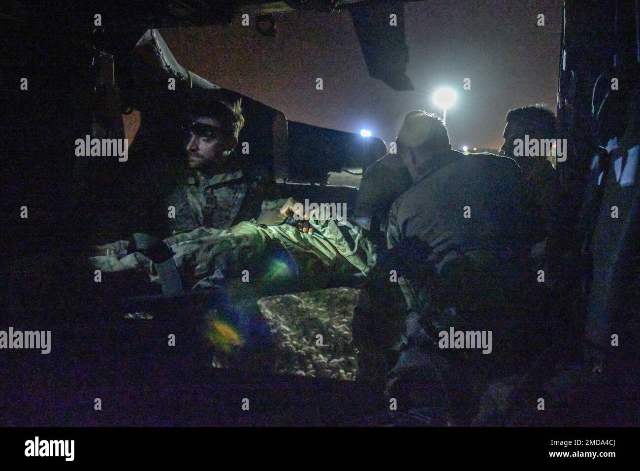 U.S. Airmen and Soldiers load a training patient onto an HH-60M MedEvac ...