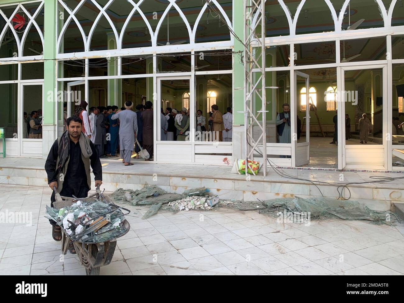 People view the damage inside of a mosque following a suicide bombers ...
