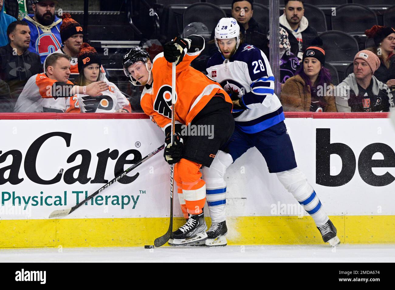 Philadelphia Flyers' Wade Allison, left, plays the puck against ...