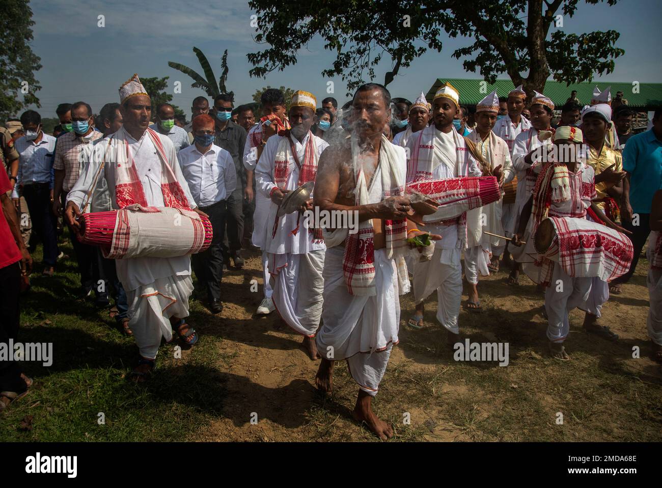 Assamese people in traditional attire perform during the opening of ...