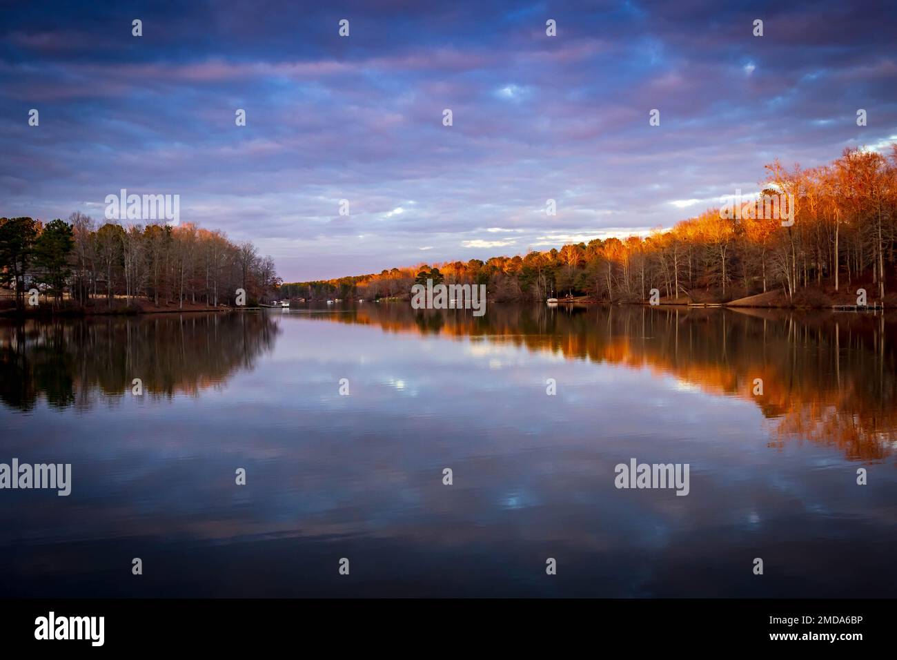 The sun rises over a beautiful lake Stock Photo - Alamy