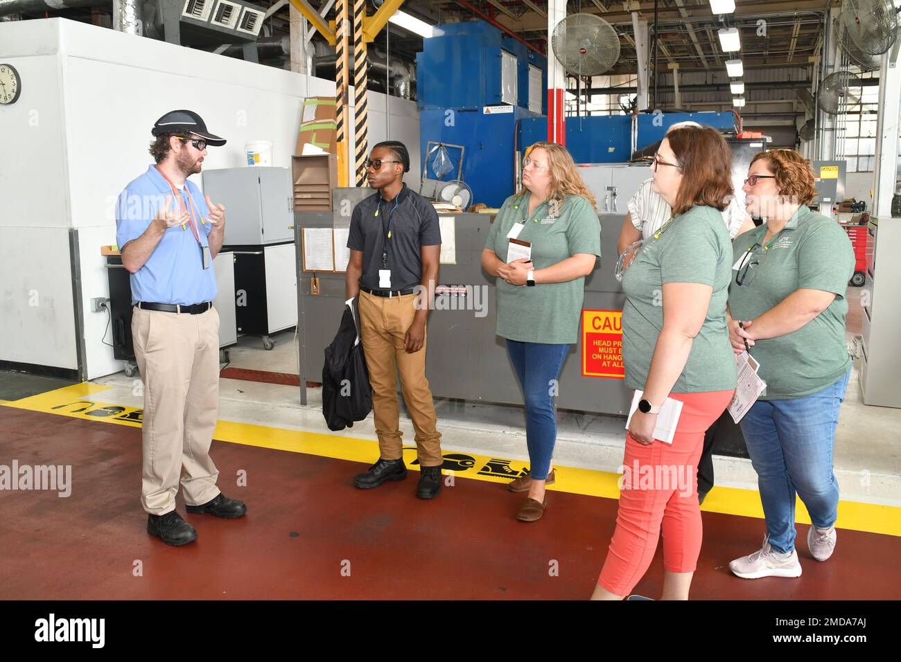 Fleet Readiness Center East (FRCE) Aerospace Engineer Sean Murphy, left ...