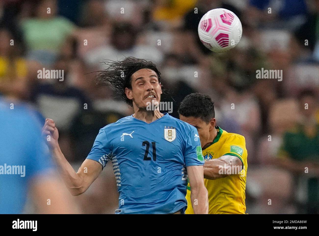 Uruguay's Edinson Cavani, front, and Brazil's Lucas Verissimo head for the ball during a ...