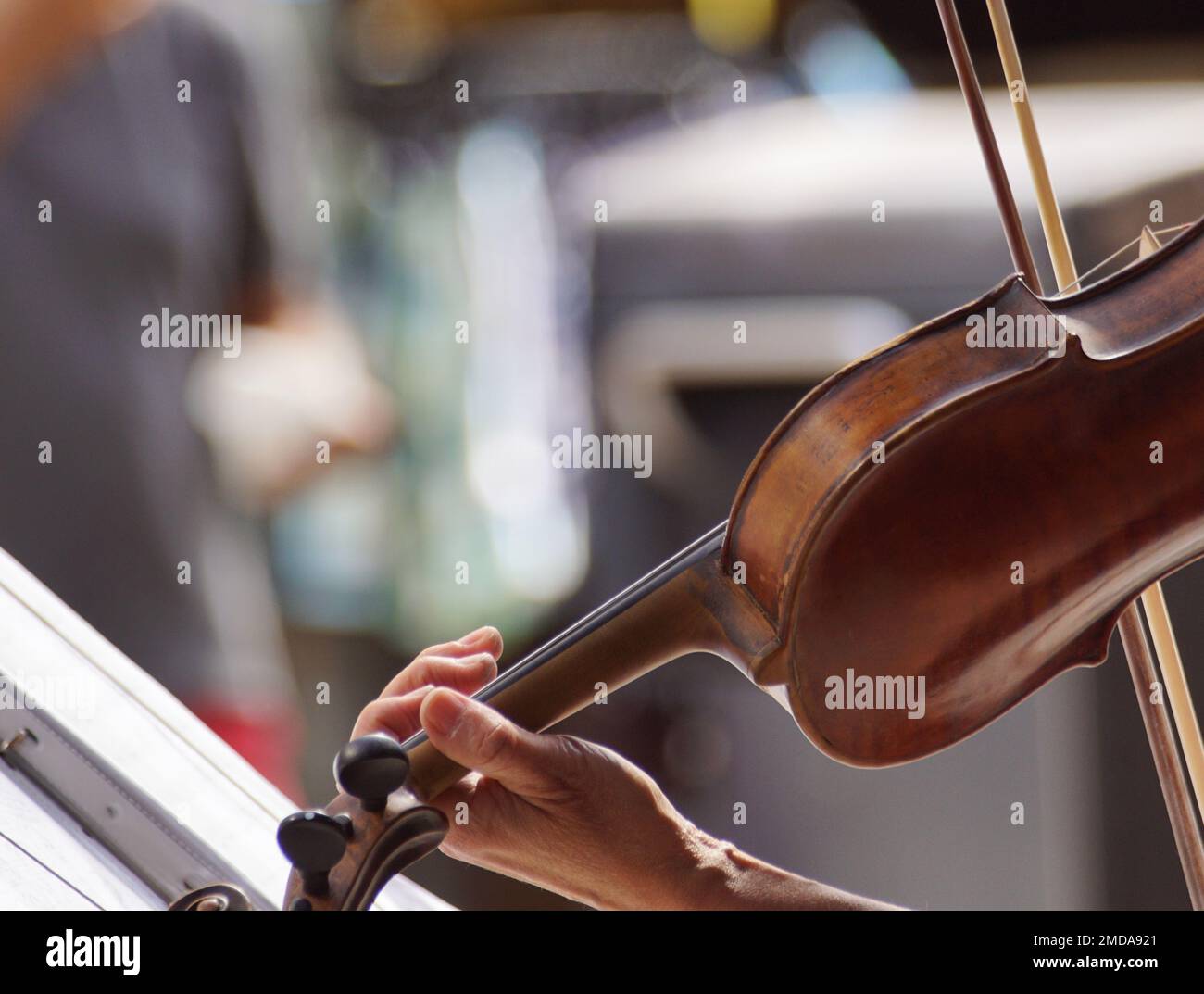 Low section of a woman playing violin Stock Photo - Alamy
