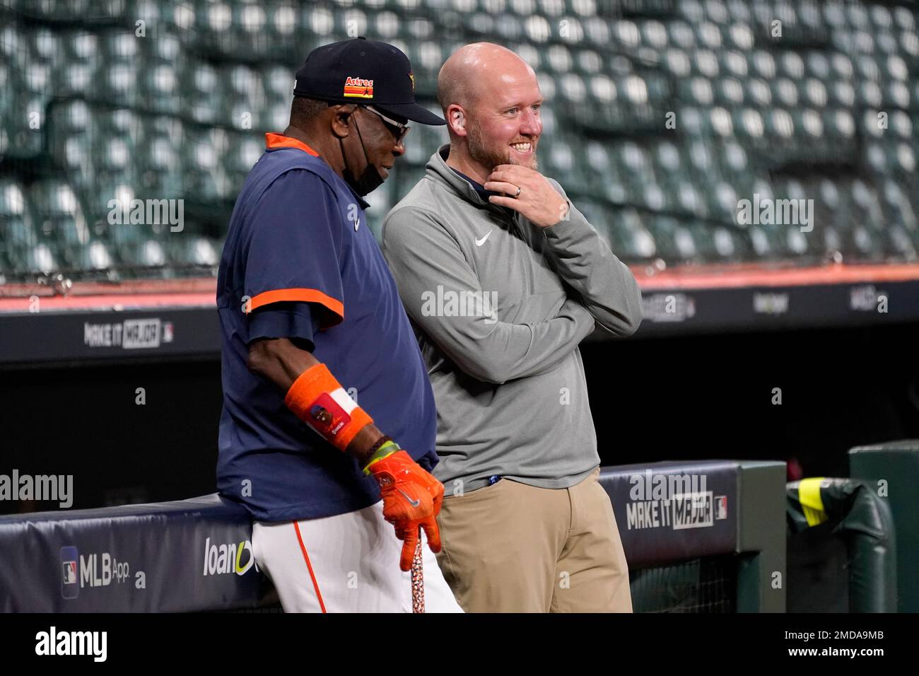 Houston Astros manager Dusty Baker, left, smiles as he talks with ...