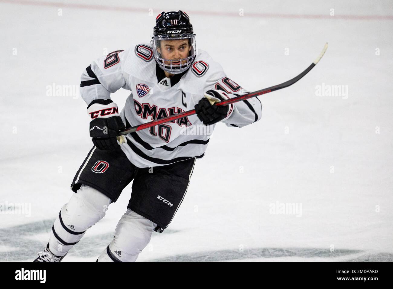 Omaha forward Kevin Conley (10) skates across the ice against Maine in ...