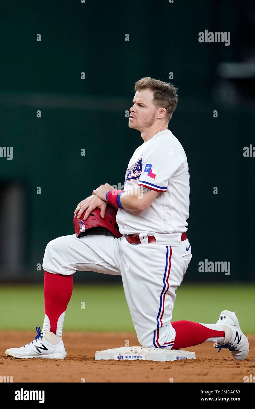 Texas Rangers' Brock Holt kneels on the second during a baseball game ...