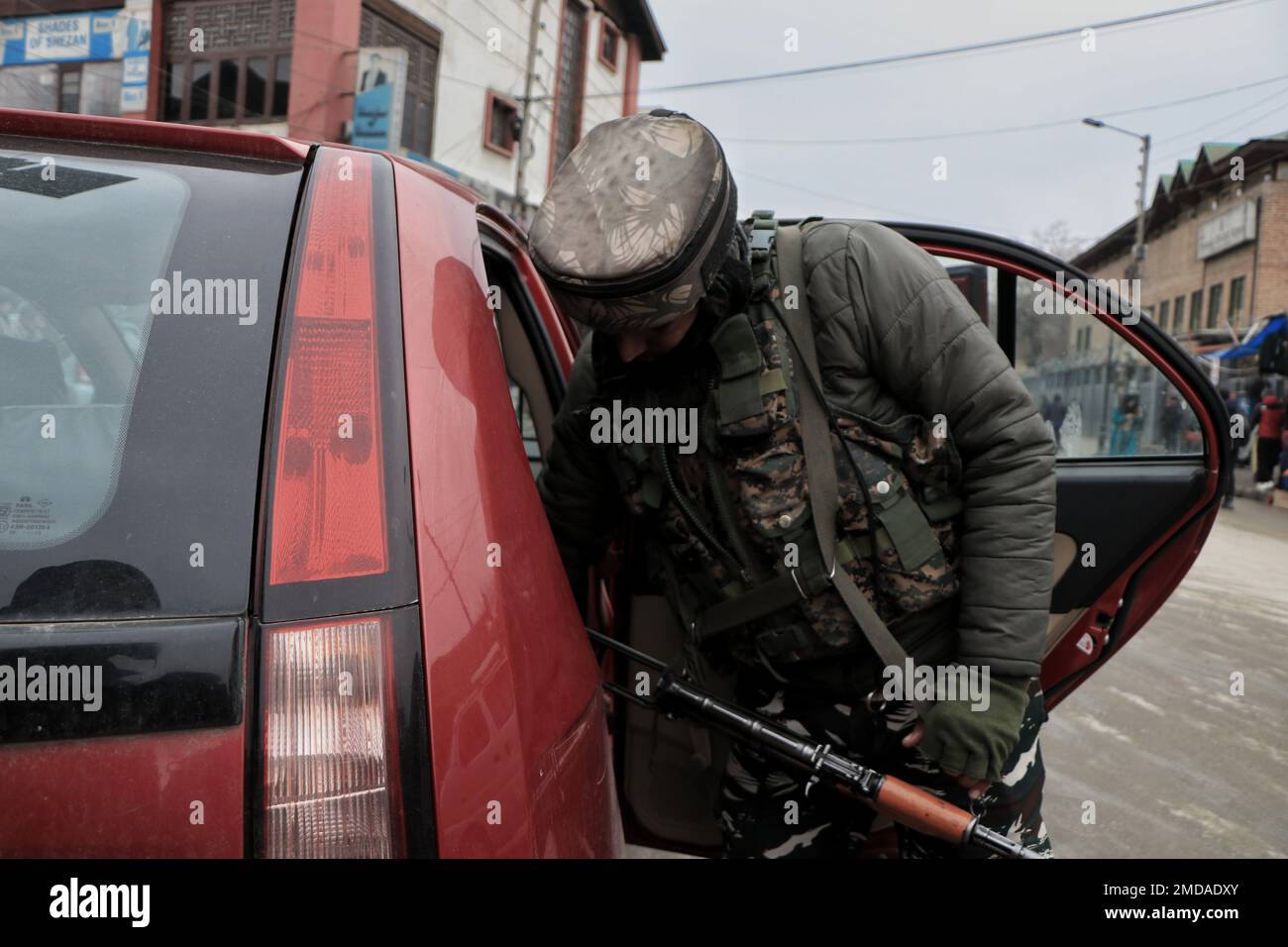 Indian paramilitary troopers frisk Kashmiri civilians in Srinagar ...