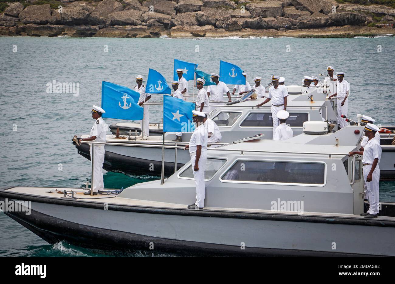 Somali Navy and Coast Guard boats patrol in the ocean next to the port ...