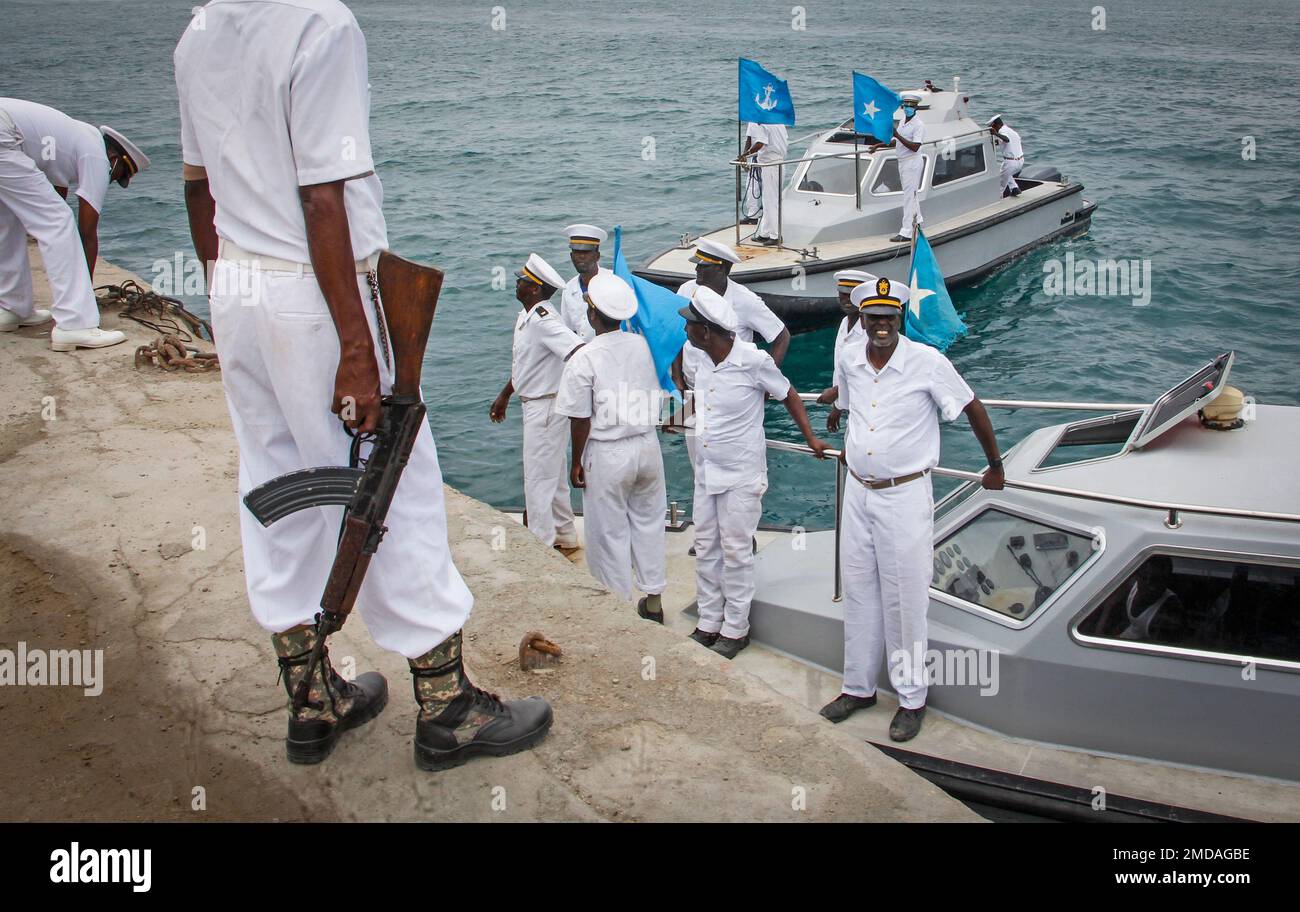 Somali Navy and Coast Guard boats make a patrol in the ocean next to ...