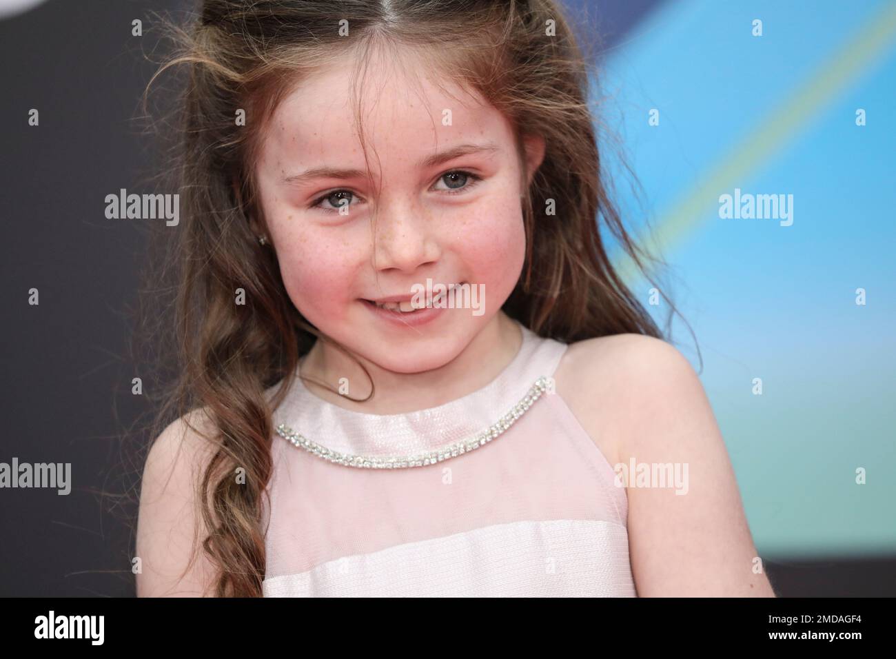 Ellie Blake poses for photographers upon arrival at the premiere of the film 'The Lost Daughter ...