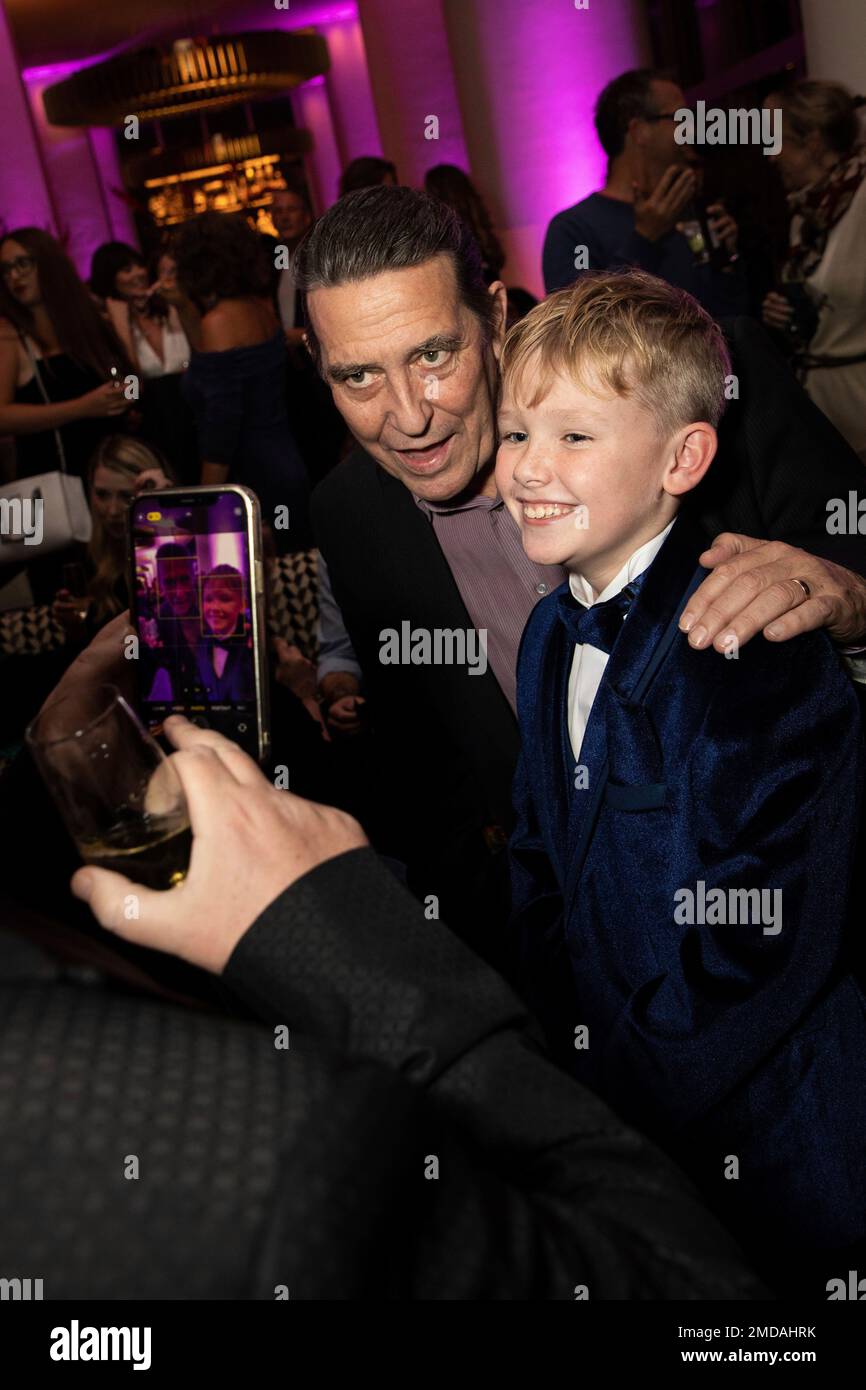 Ciaran Hinds, left, and Jude Hill pose for photographers at the party ...
