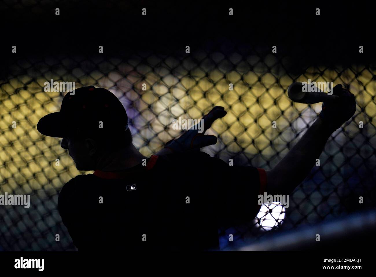A San Francisco Giants batter is silhouetted during batting practice ...