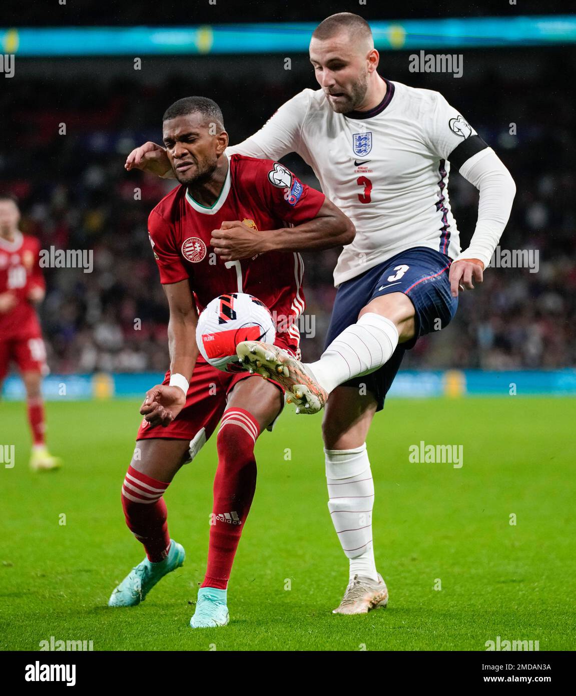 England's Luke Shaw, right, and Hungary's Loic Nego battle for the ball ...