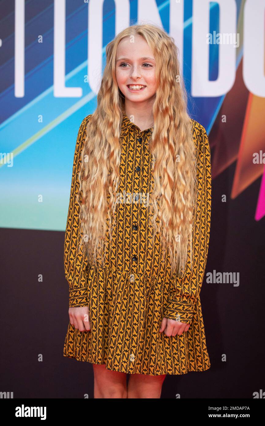 Olive Tennant poses for photographers upon arrival at the premiere of ...
