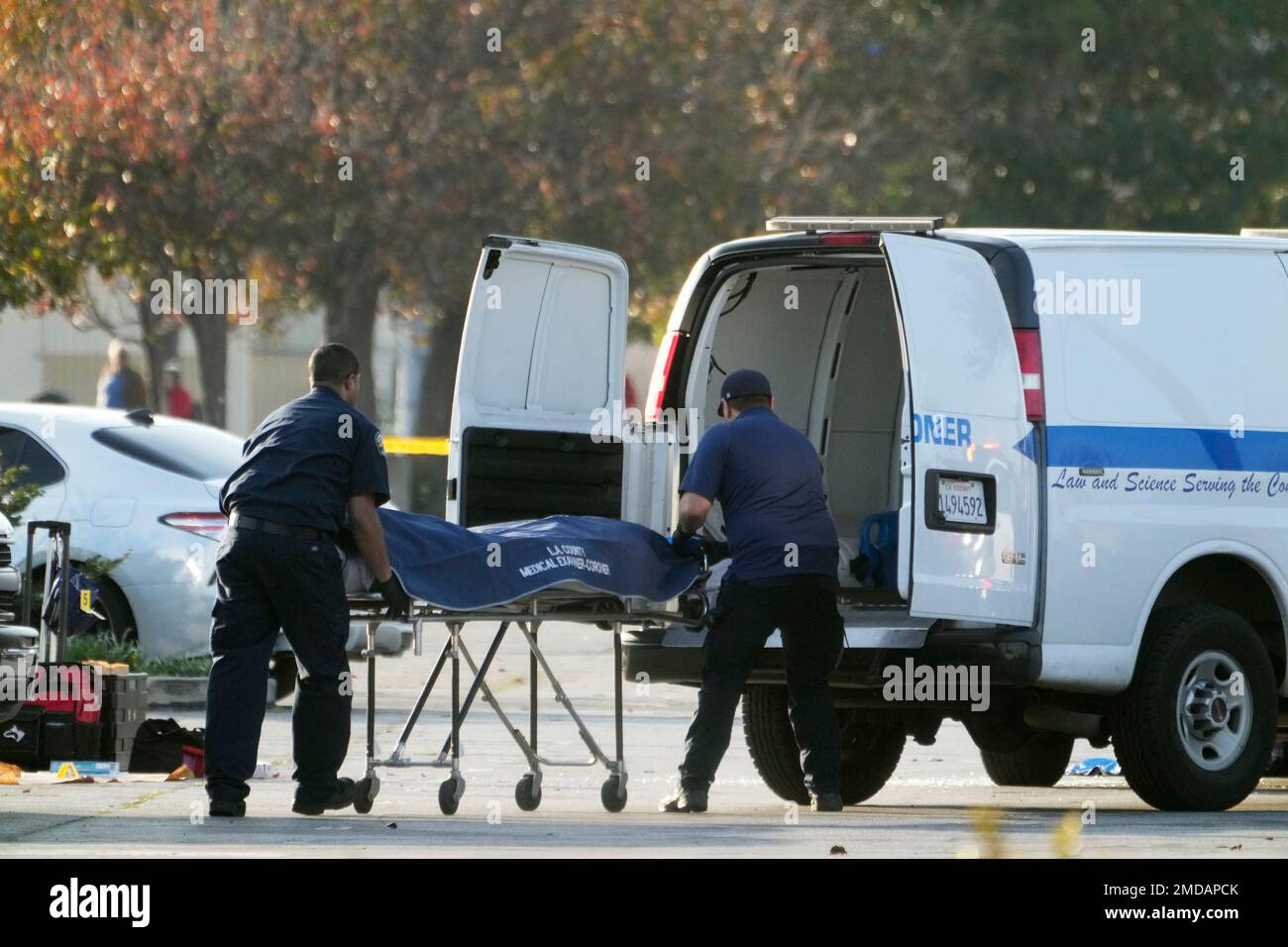 The body of Huu Can Tran is retrieved from a van by the Los Angeles ...