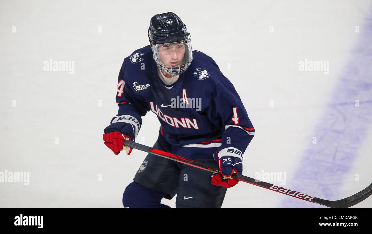 Connecticut's Roman Kinal (4) skates during the first period of an NCAA ...