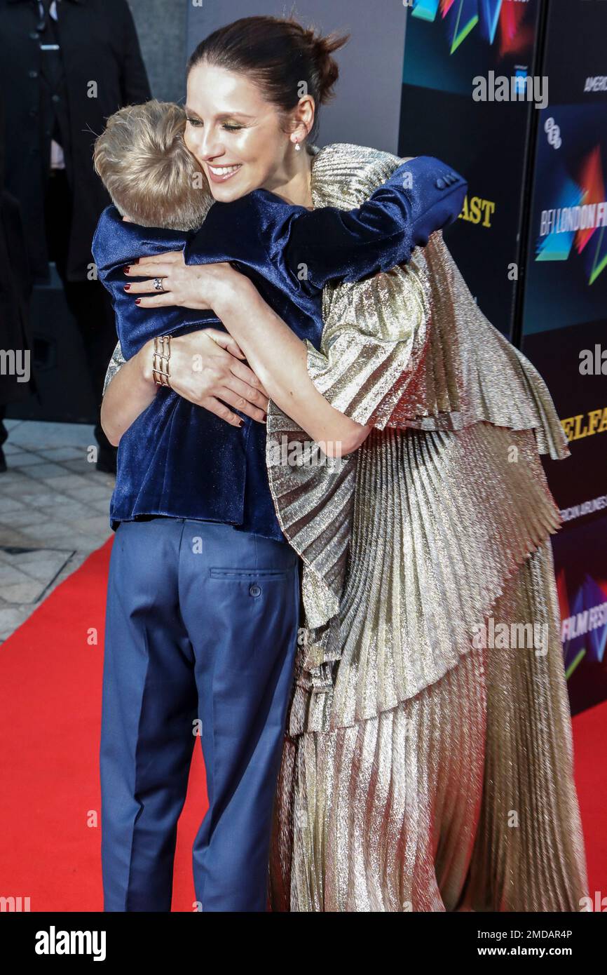 Caitriona Balfe, right, embraces Jude Hill upon arrival at the premiere of the film 'Belfast ...