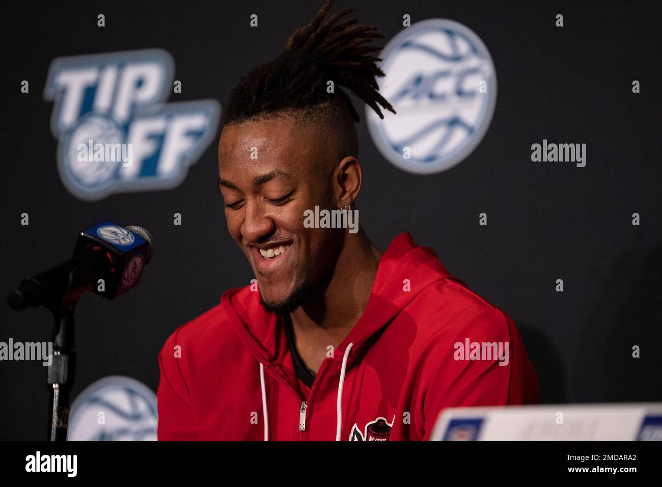 North Carolina State forward Manny Bates laughs during NCAA college ...