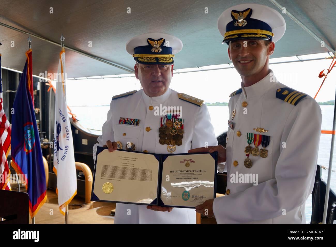 The U.S. Coast Guard District Fourteen Commander, Rear Adm. Michael Day ...