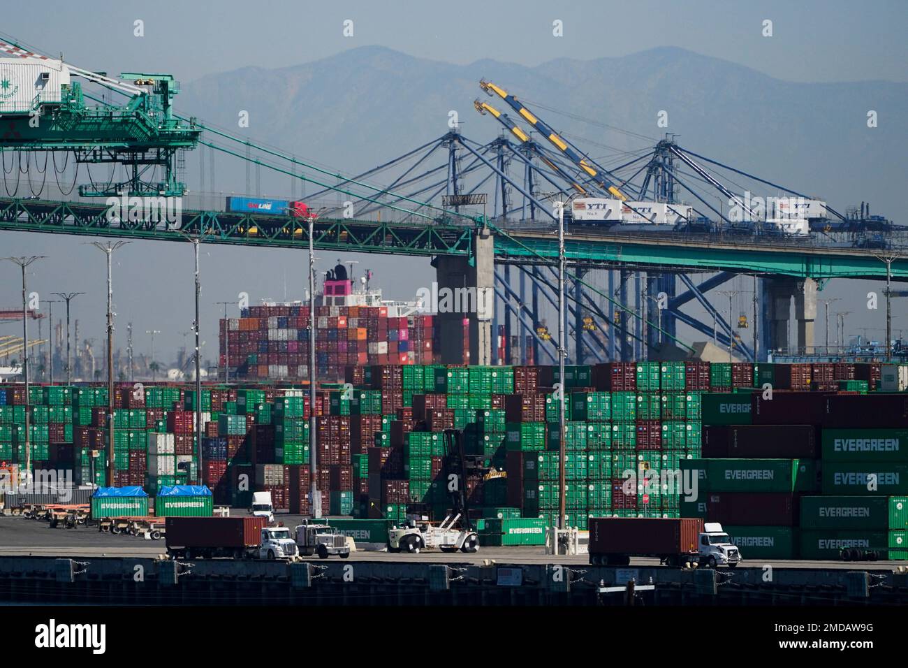 Containers are stacked at the Port of Los Angeles in Los Angeles ...