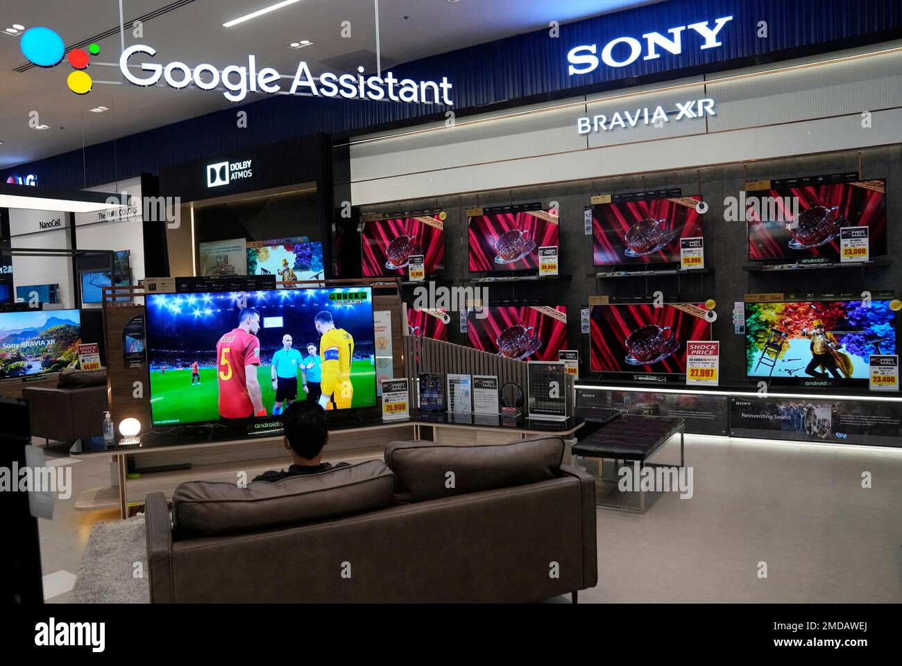 A Customer views a LED screen TV at an electronic store in a shopping ...