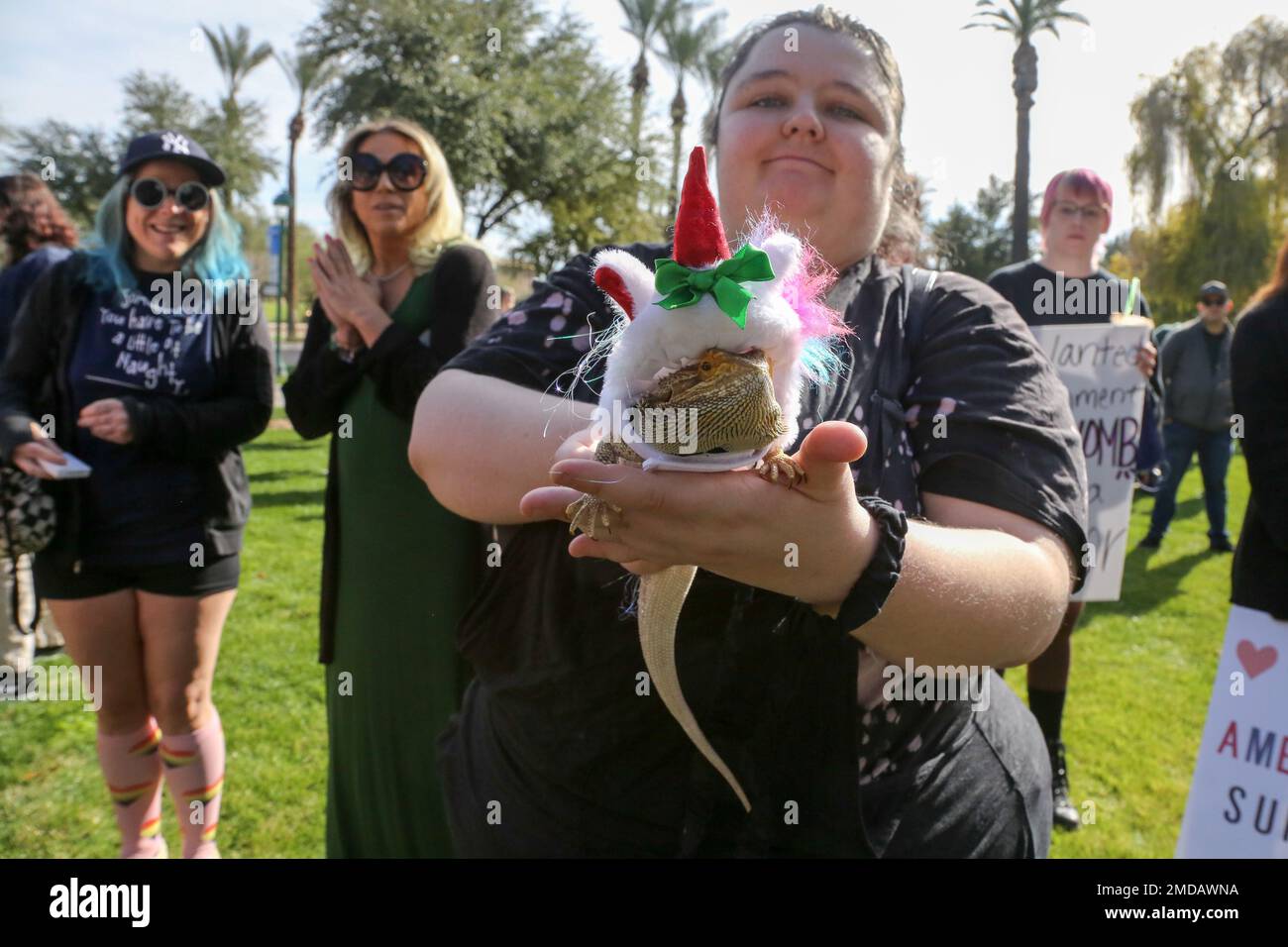 A woman brings her Bearded Dragon with her to participate in the Bigger ...