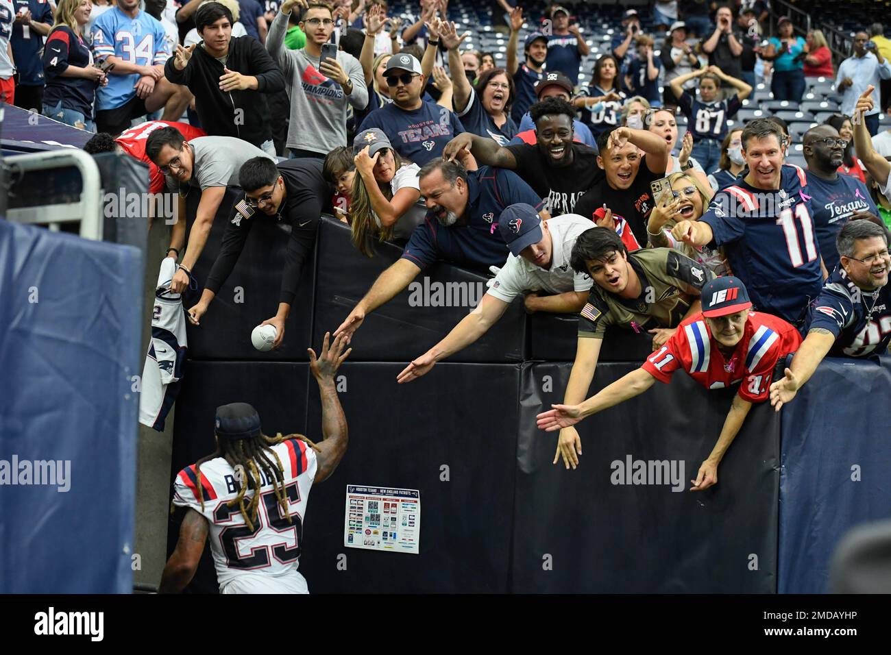 New England Patriots running back Brandon Bolden (25) high fives fans ...