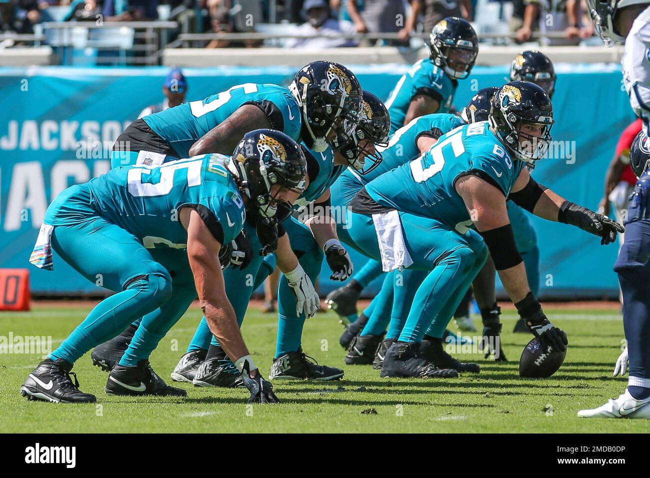 Jacksonville Jaguars center Brandon Linder (65), right, calls out a ...
